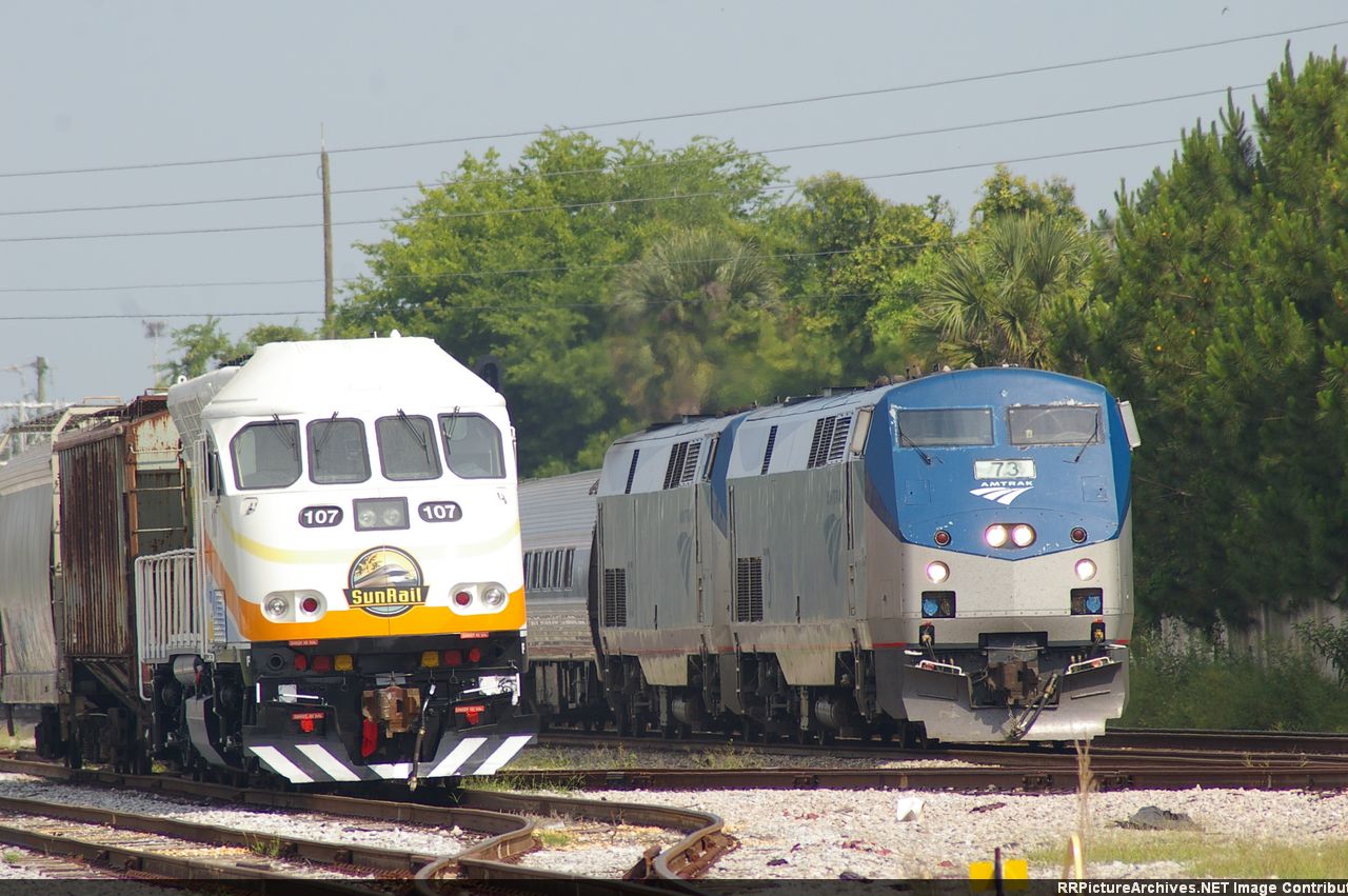 AMTK 73 PASSING CFRC 107 SITTING IN YARD